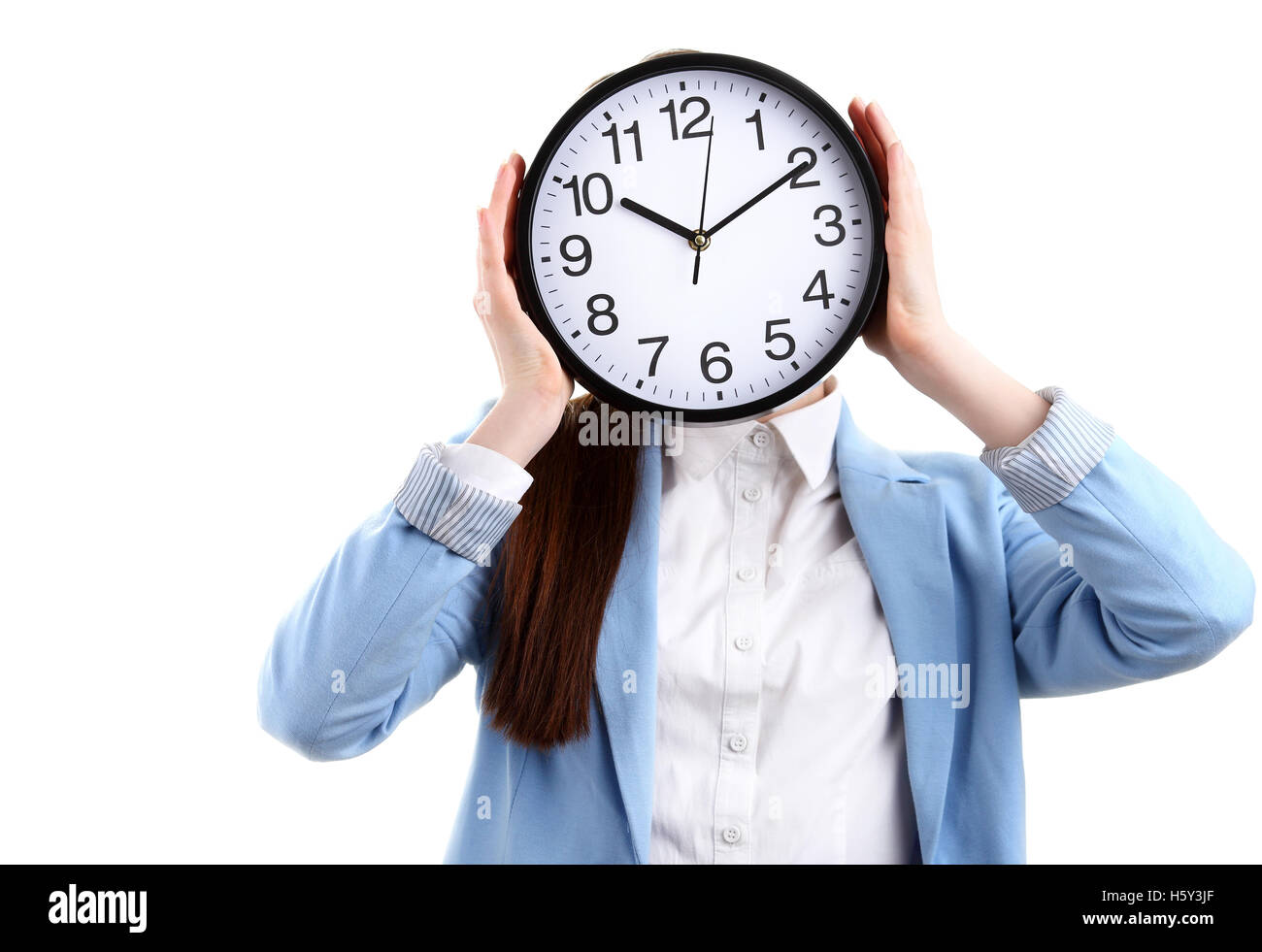 Portrait of beautiful young girl hiding face behind clock Stock Photo ...
