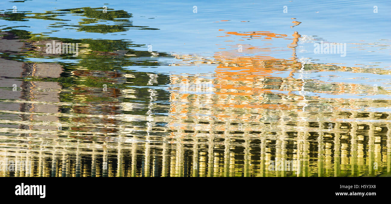 Colored reflections in harbor water Stock Photo - Alamy
