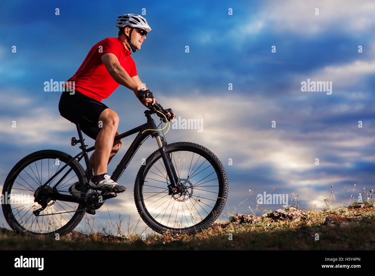 Mountain biker riding on bike singletrack trail hi-res stock ...