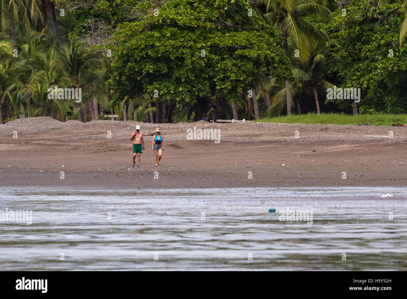 Tambor, Costa Rica - June 22: couple going for a nice long walk on the ...