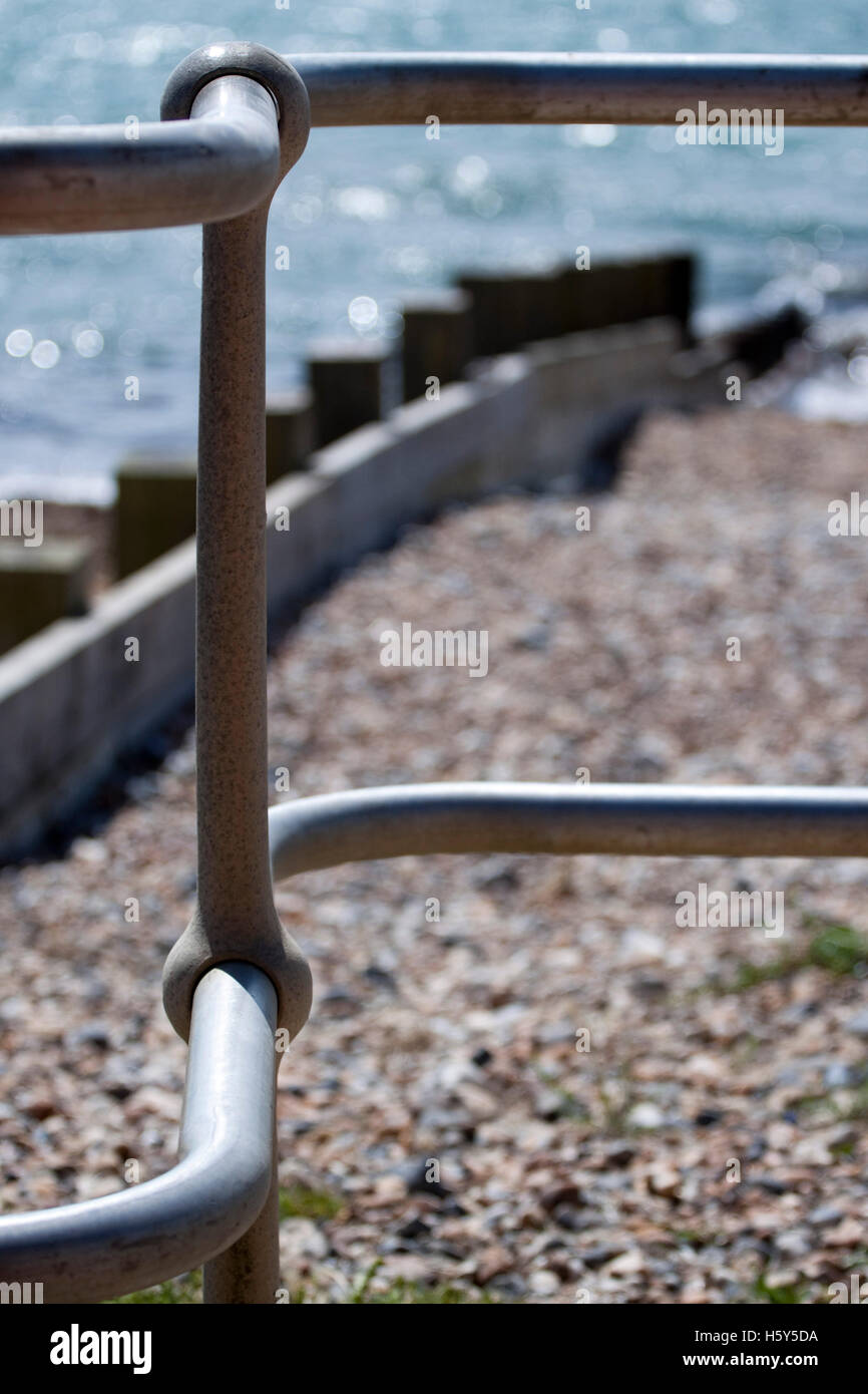 Metal railings on the beach at the British coastal town Rustington ...