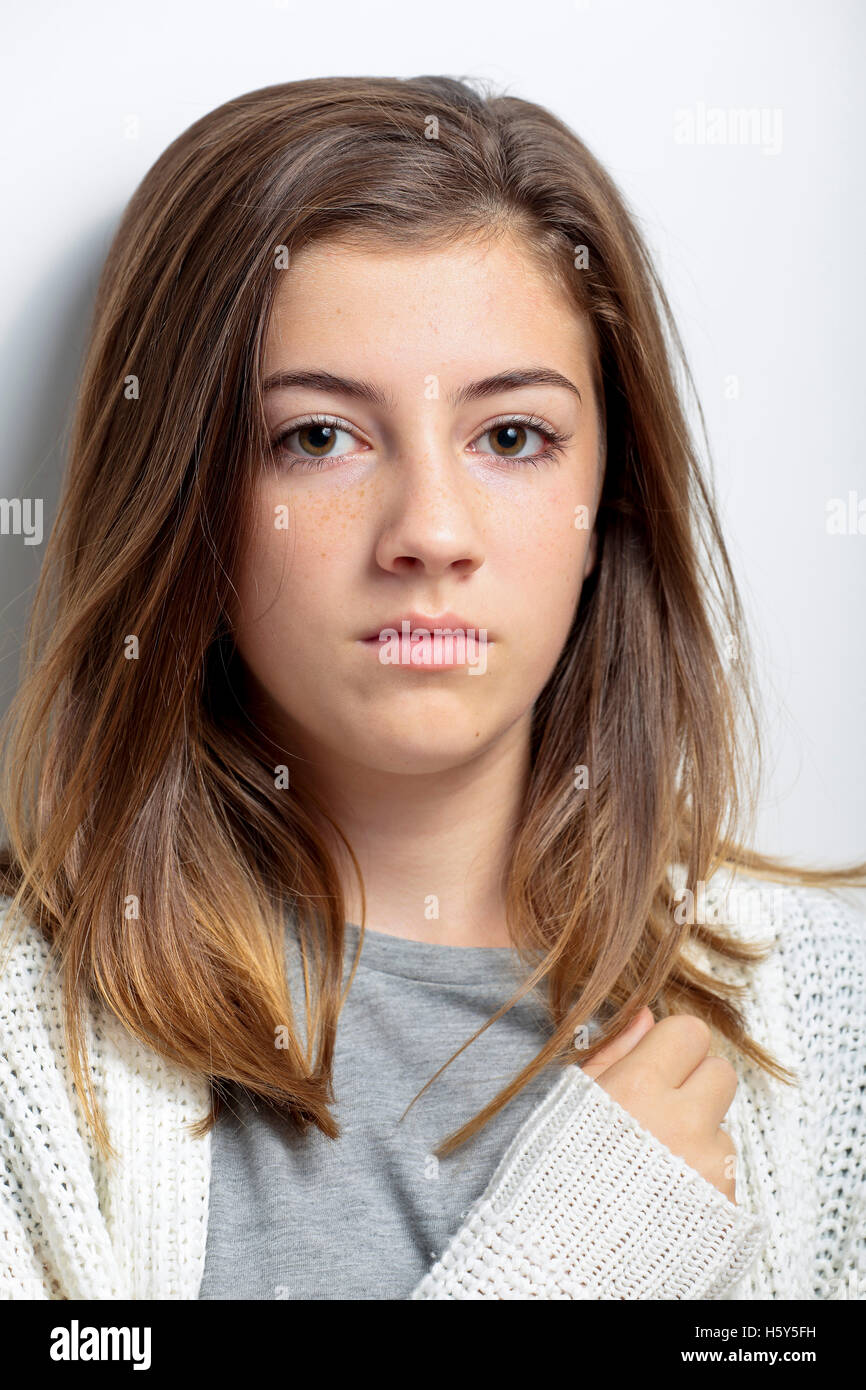 Portrait of a teenager with a serious face. Capture vertical light of ...