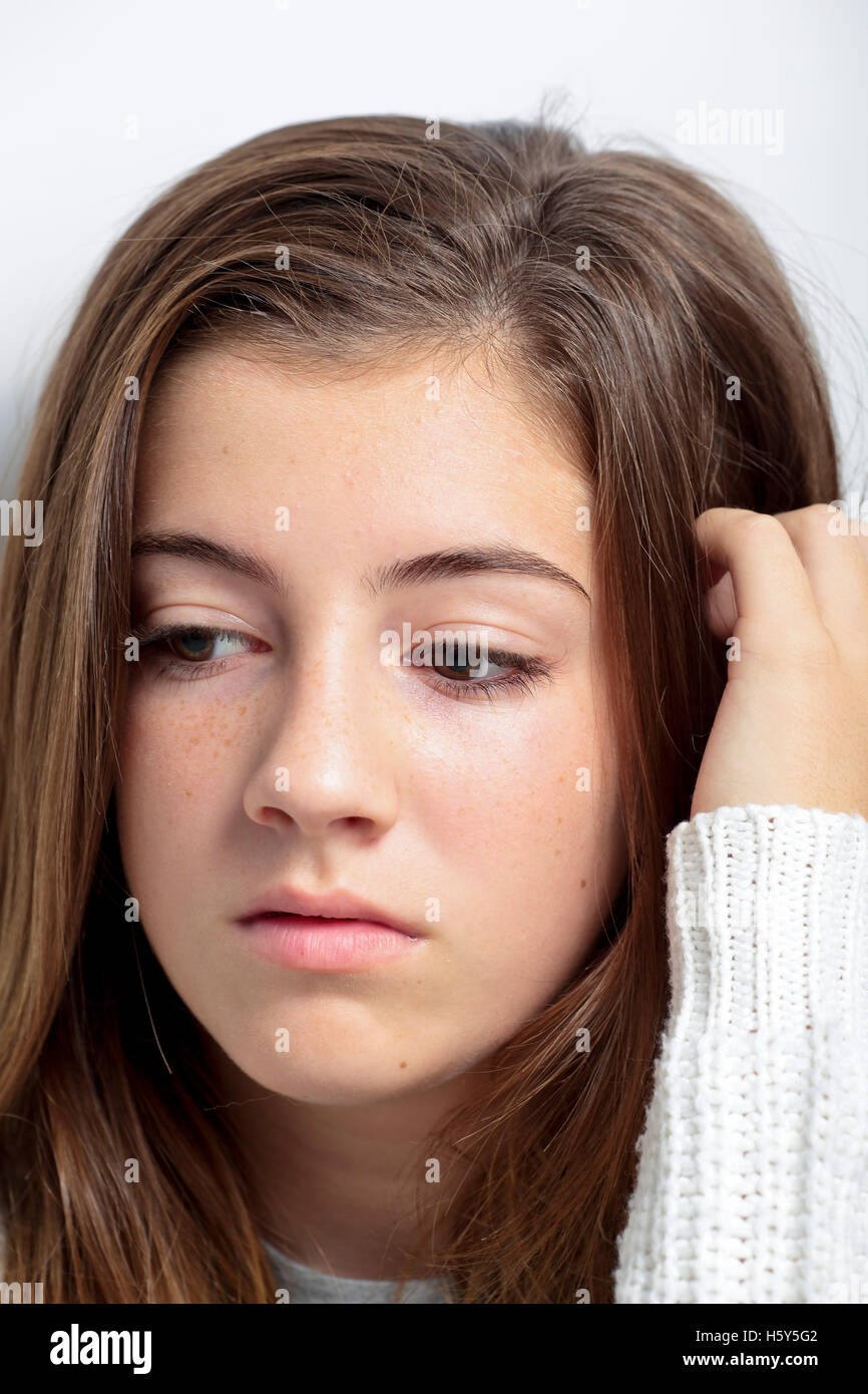 Portrait of a teenager with a serious face. Capture vertical light of ...