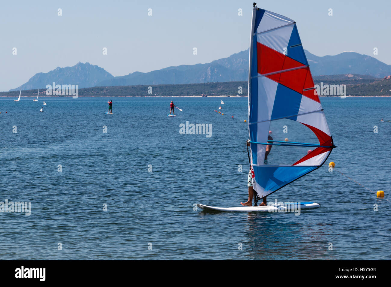Wind Surfing in the Summer on Calm Coastal Water, Small Island in ...