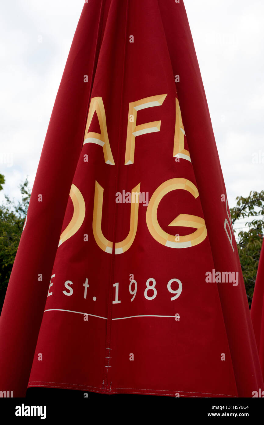 Cafe Rouge sun shade, folded up Stock Photo - Alamy