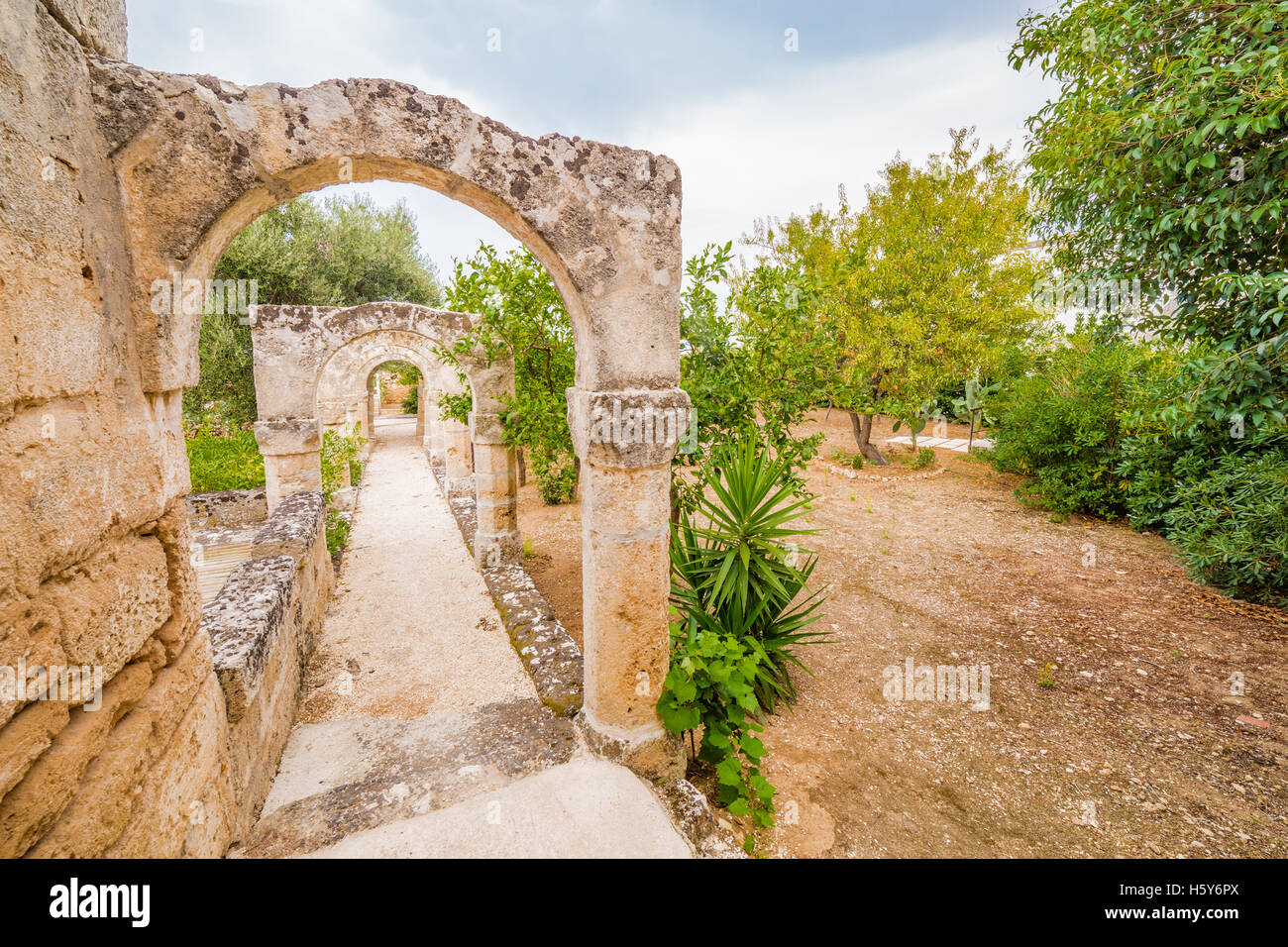 gallery of arches in garden in Italy Stock Photo - Alamy