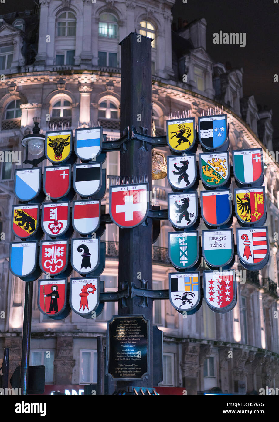 Flags at Swiss clock Leicester Square London Stock Photo - Alamy