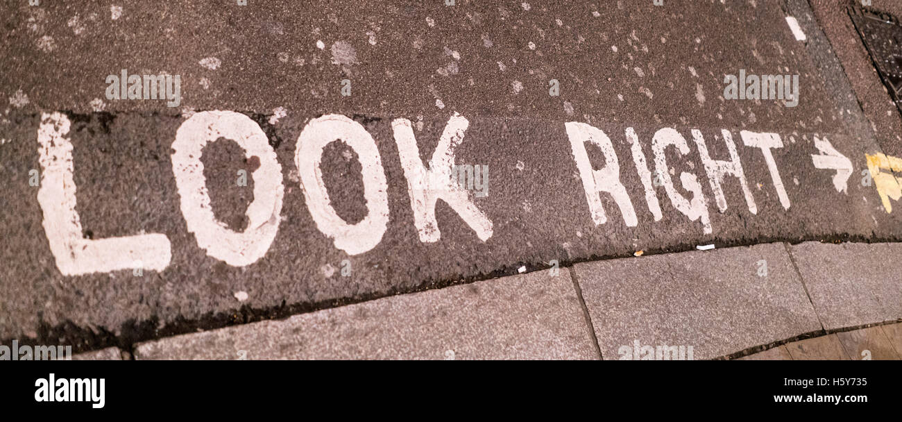 Look right writing on the street Stock Photo - Alamy