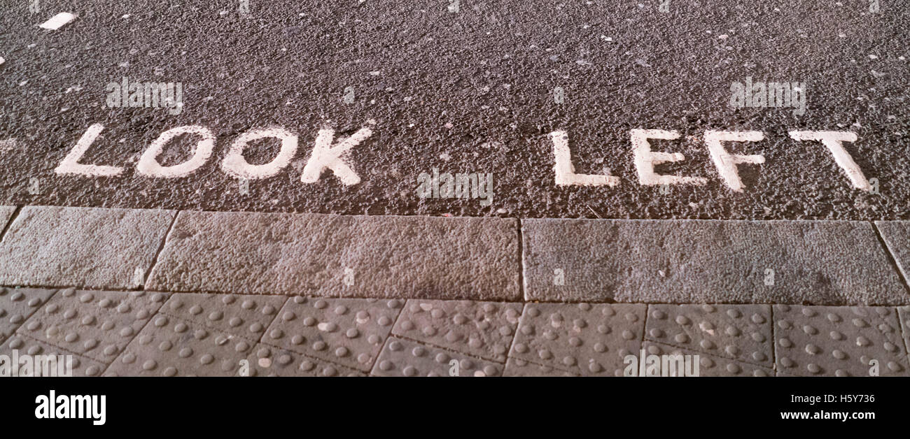 Look left writing on the street Stock Photo - Alamy