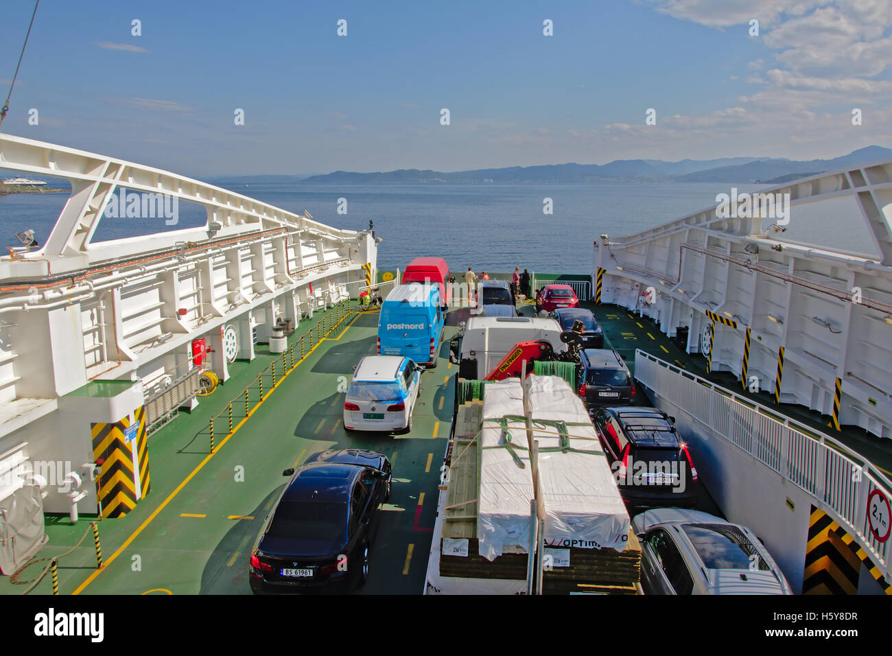 Cars parked on a ferry in a fjord Stock Photo - Alamy