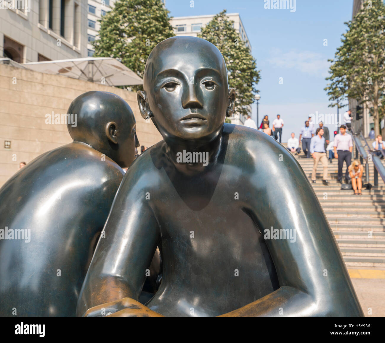Statue of two sitting men at Cubitt steps in Canary Wharf Stock Photo ...