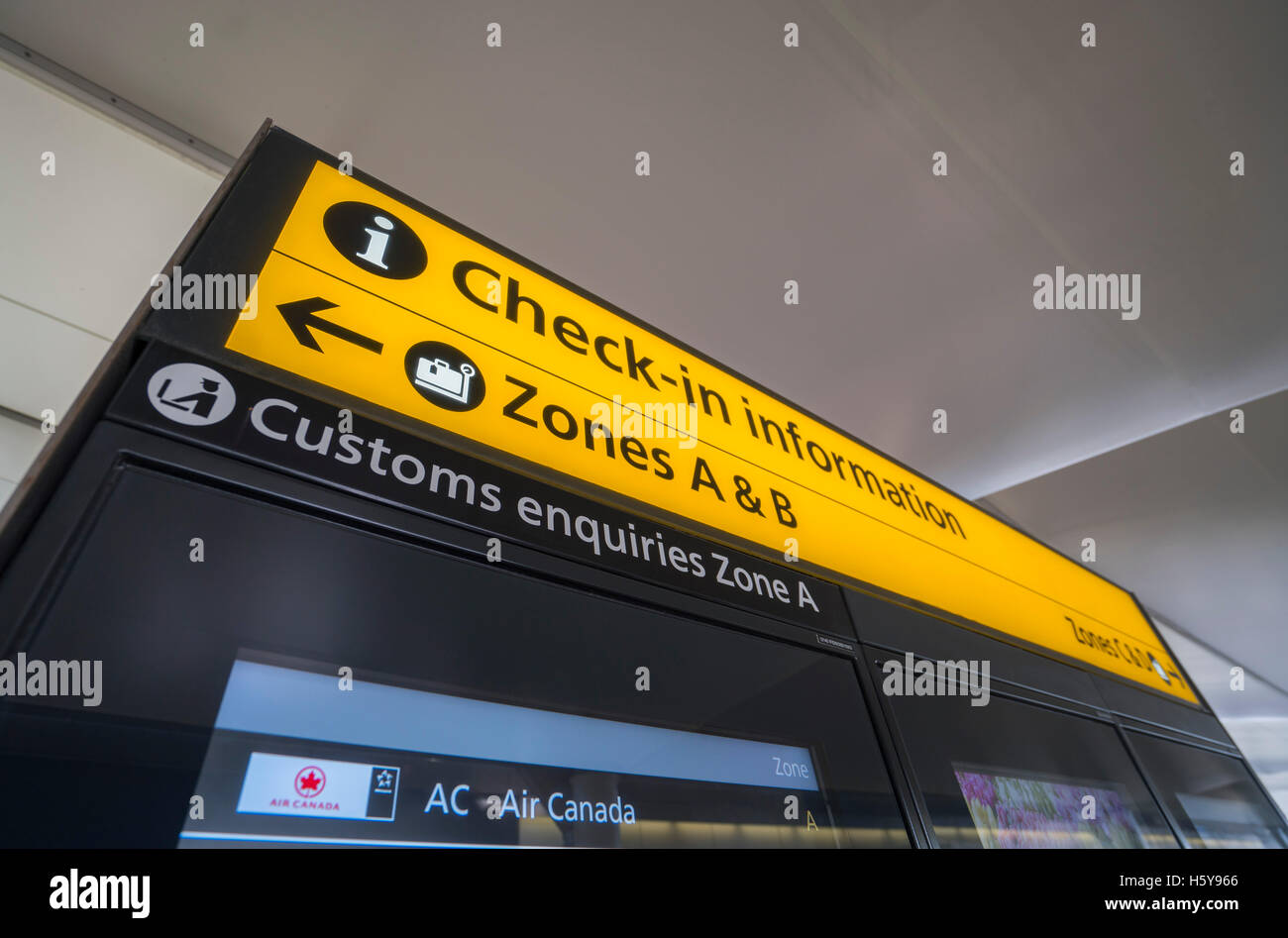 Check In information at the airport Stock Photo - Alamy