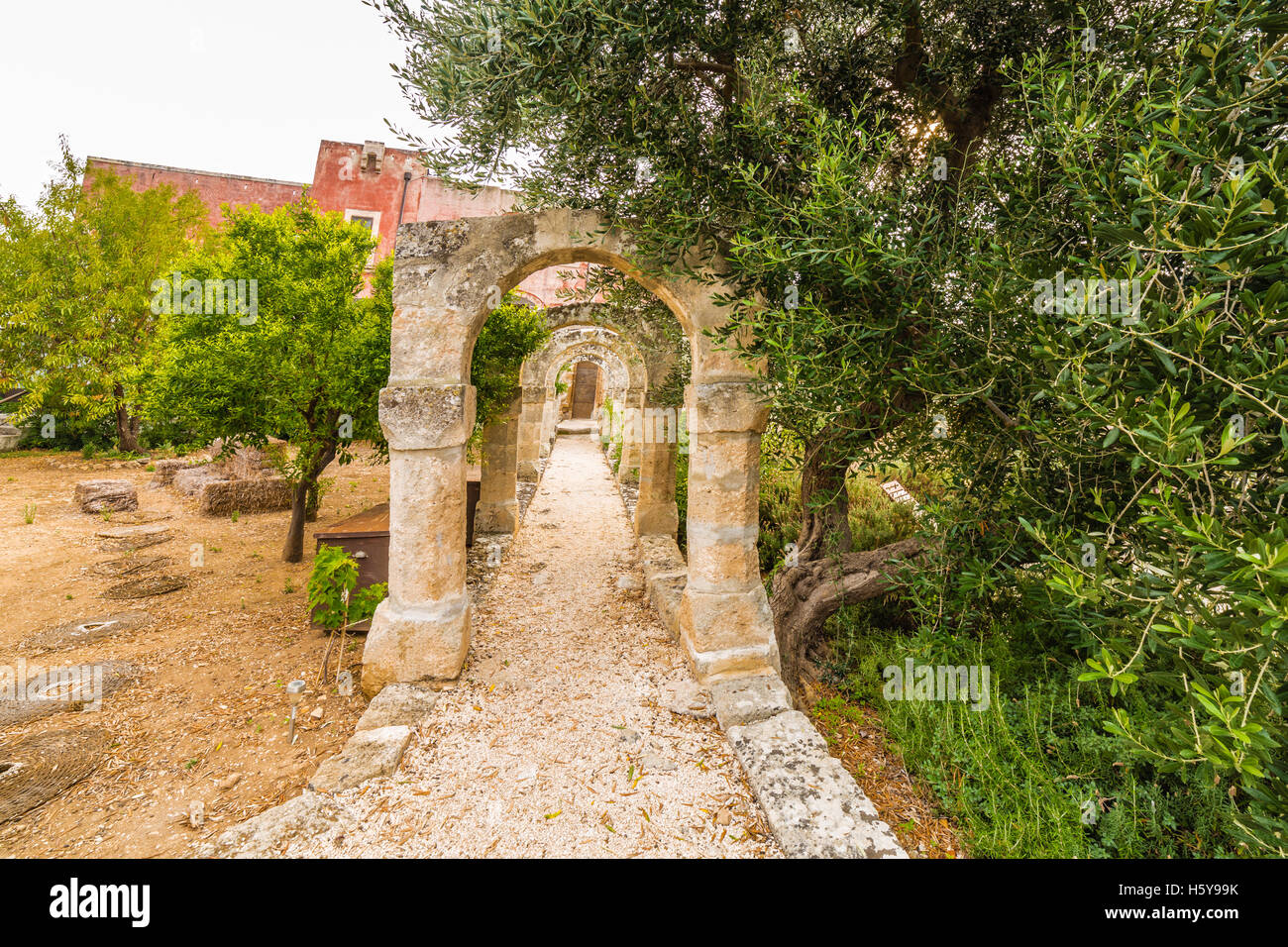 gallery of arches in garden in Italy Stock Photo - Alamy