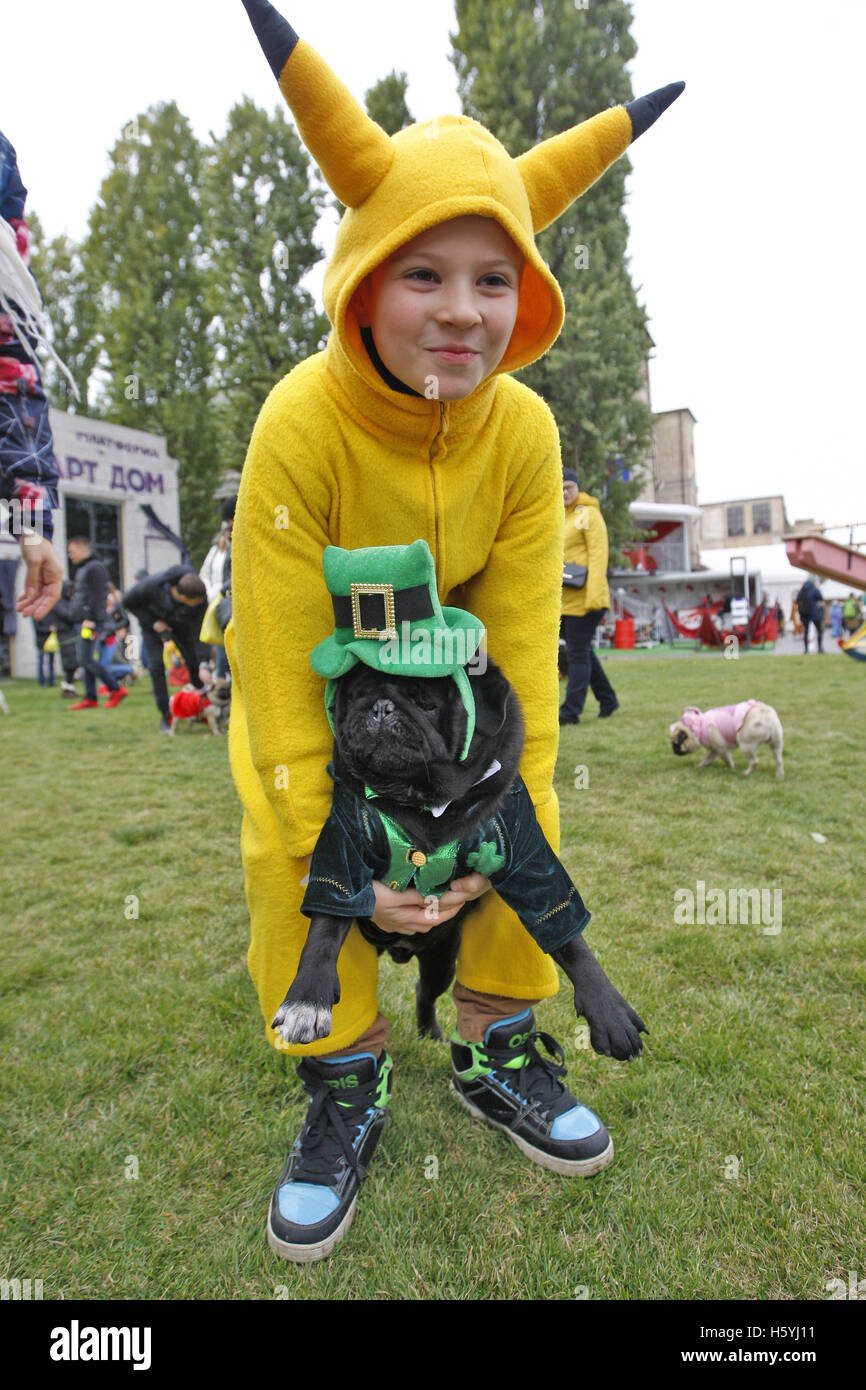 Kiev, Ukraine. 22nd Oct, 2016. A boy dressed in a suit Pikachu holds a ...