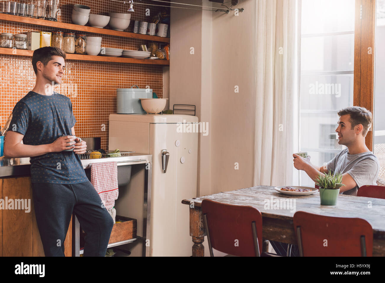 Taking the morning slowly with coffee and conversation Stock Photo - Alamy