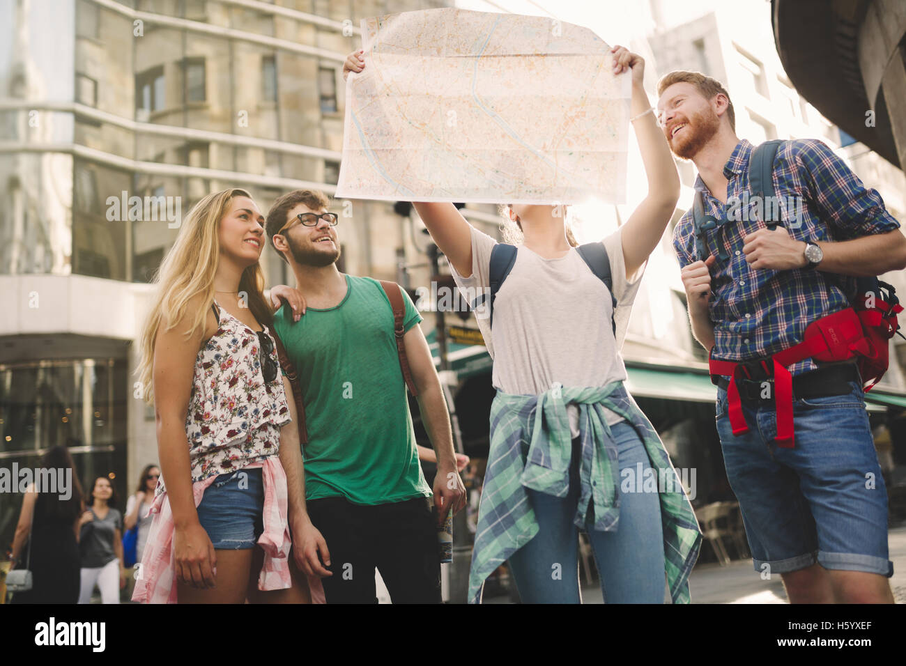 Tourist group led by tour guide on their travel Stock Photo - Alamy