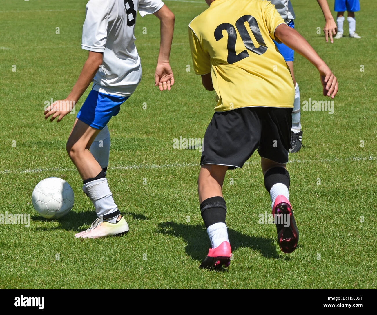 Young soccer players in action Stock Photo - Alamy