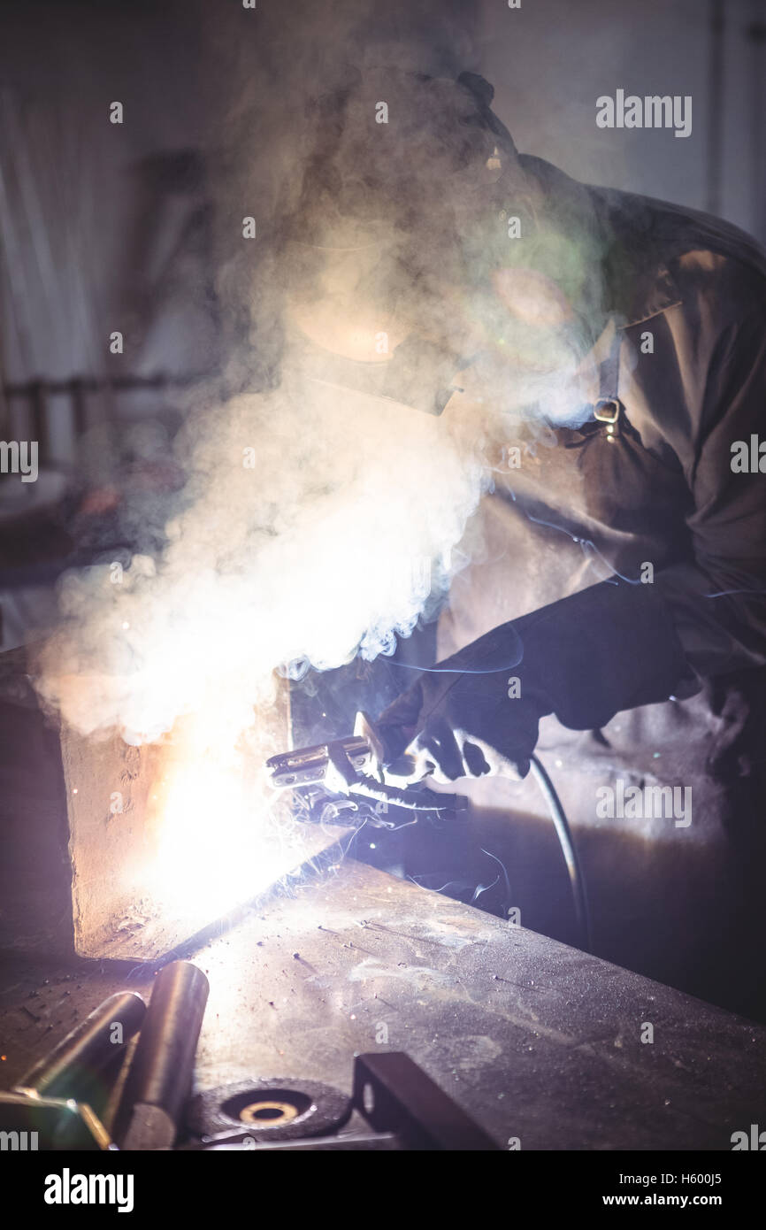 Welder welding a metal Stock Photo - Alamy