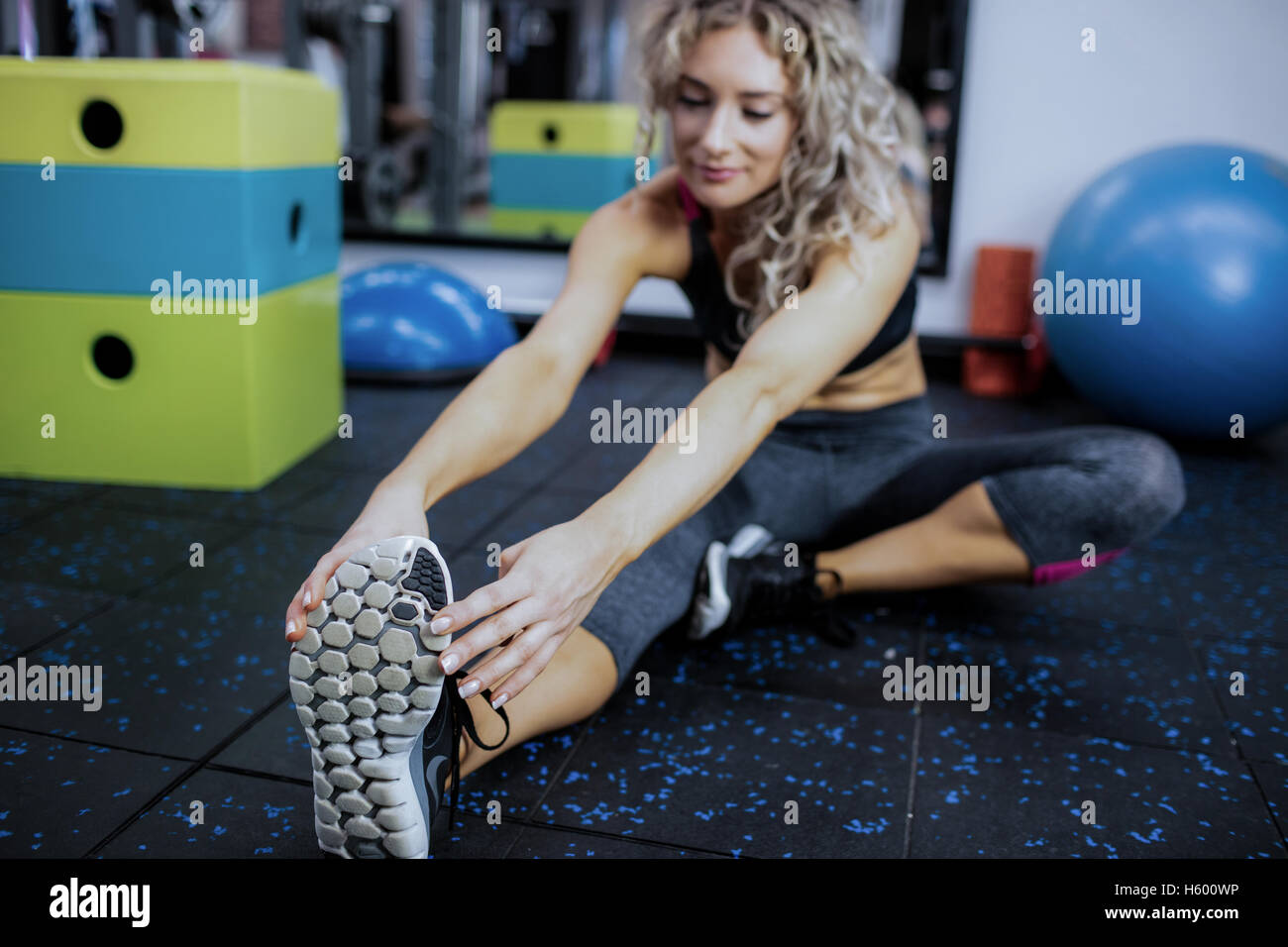 Woman performing stretching exercise Stock Photo - Alamy