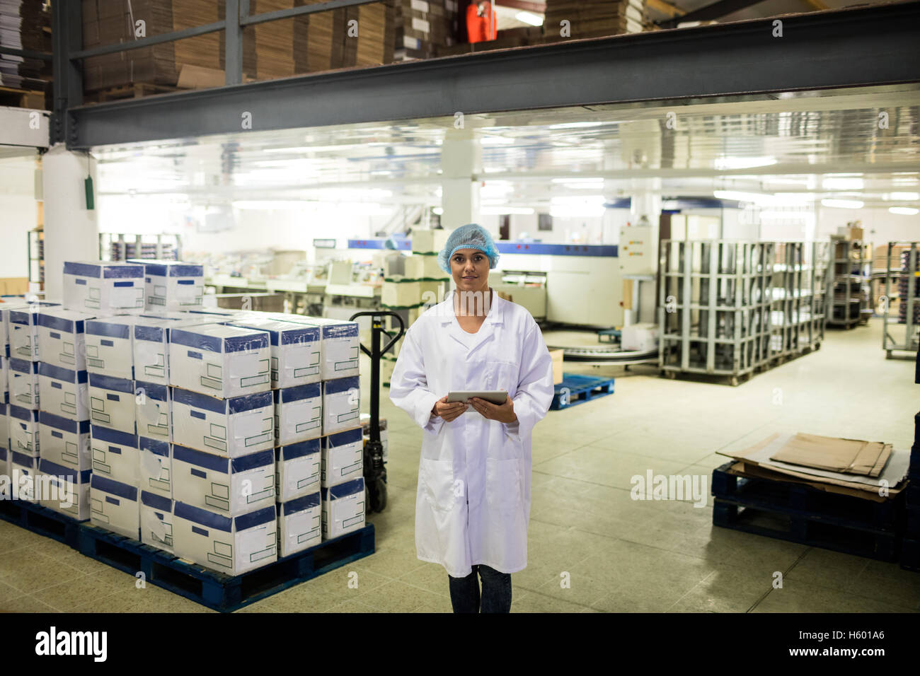 Female staff using digital tablet Stock Photo - Alamy