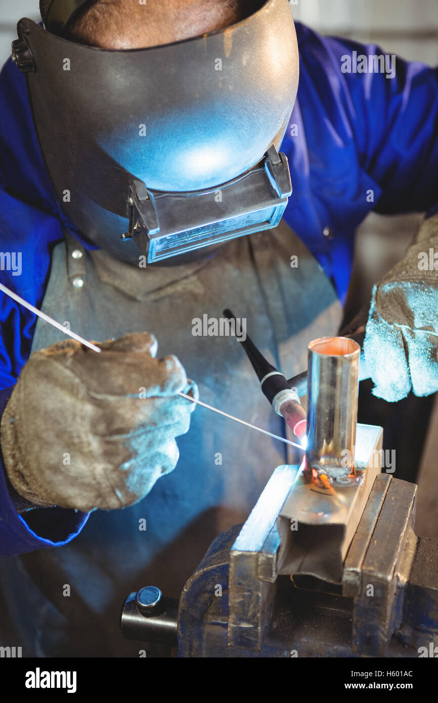 Welder welding a metal Stock Photo - Alamy