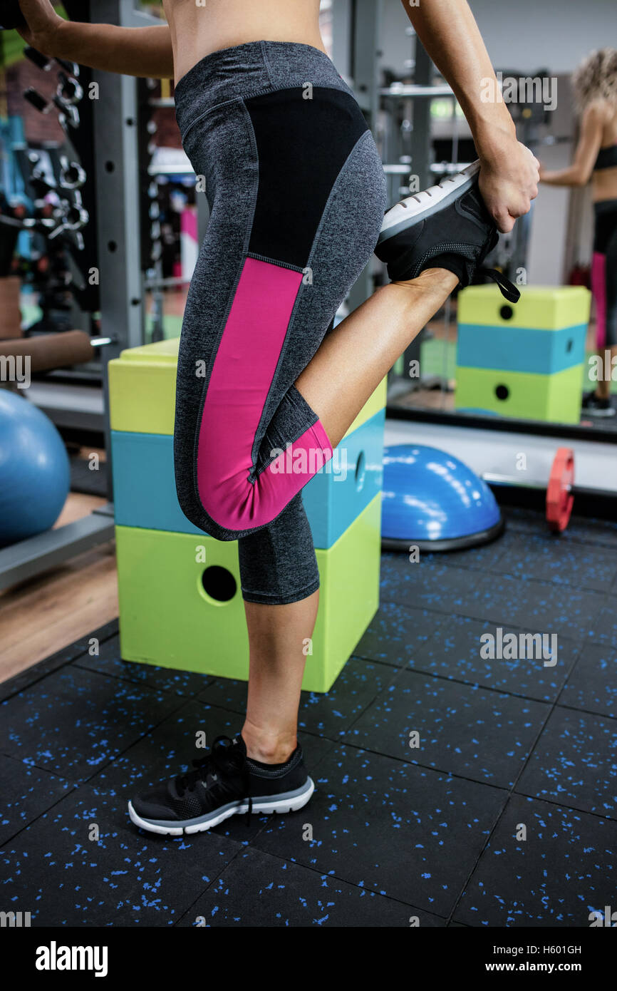 Woman performing stretching exercise Stock Photo - Alamy