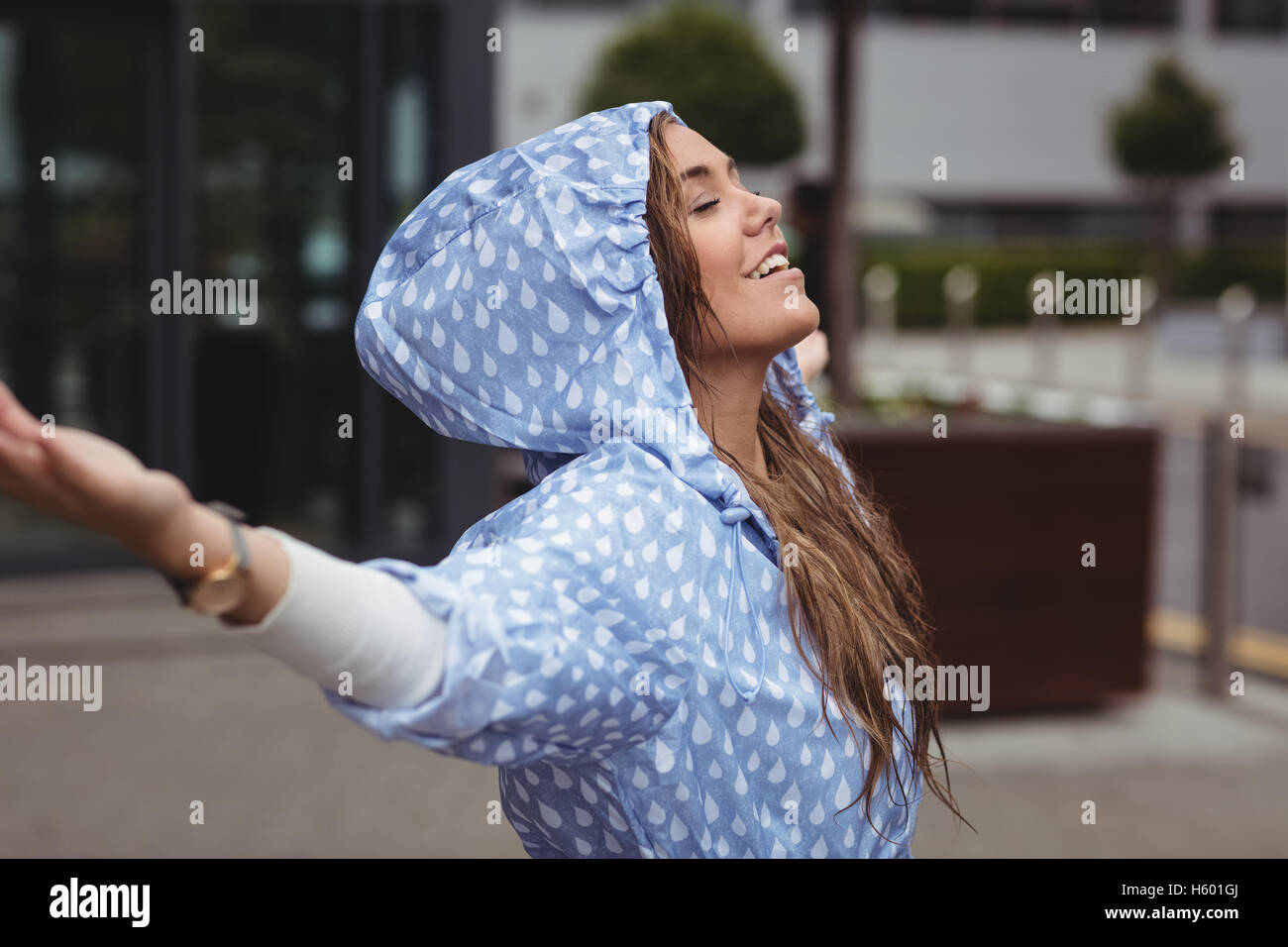 Beautiful woman enjoying rain Stock Photo - Alamy