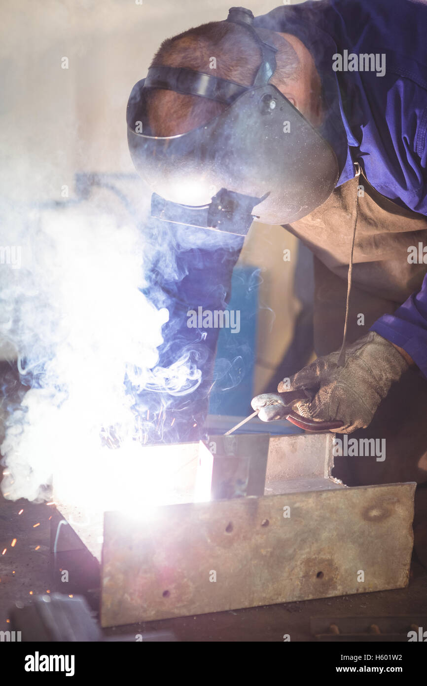 Welder welding a metal Stock Photo - Alamy