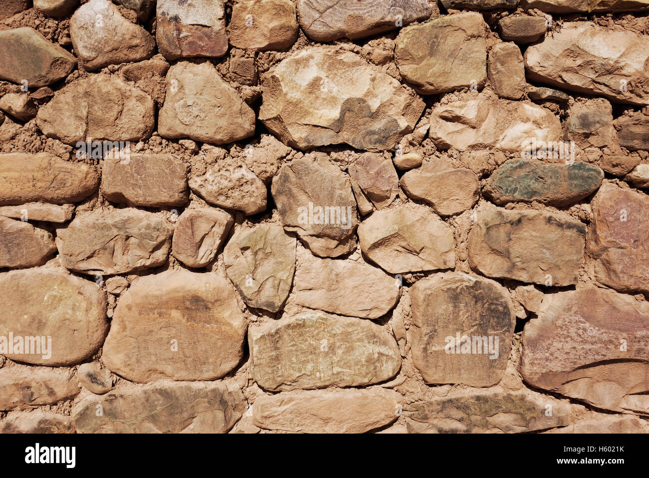 Old rough stone wall, background wallpaper Stock Photo - Alamy