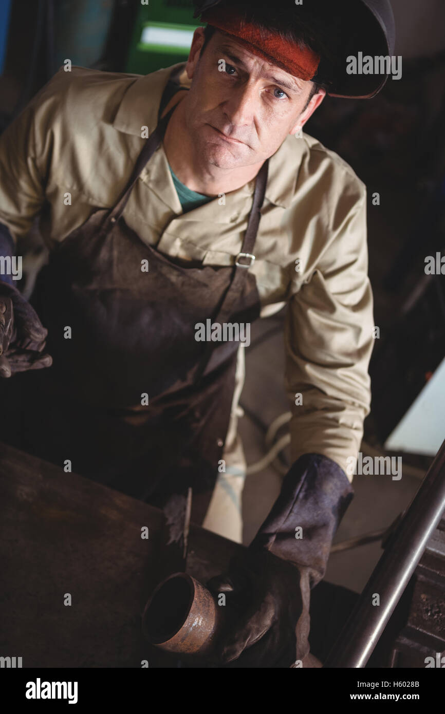Portrait of welder standing in workshop Stock Photo - Alamy