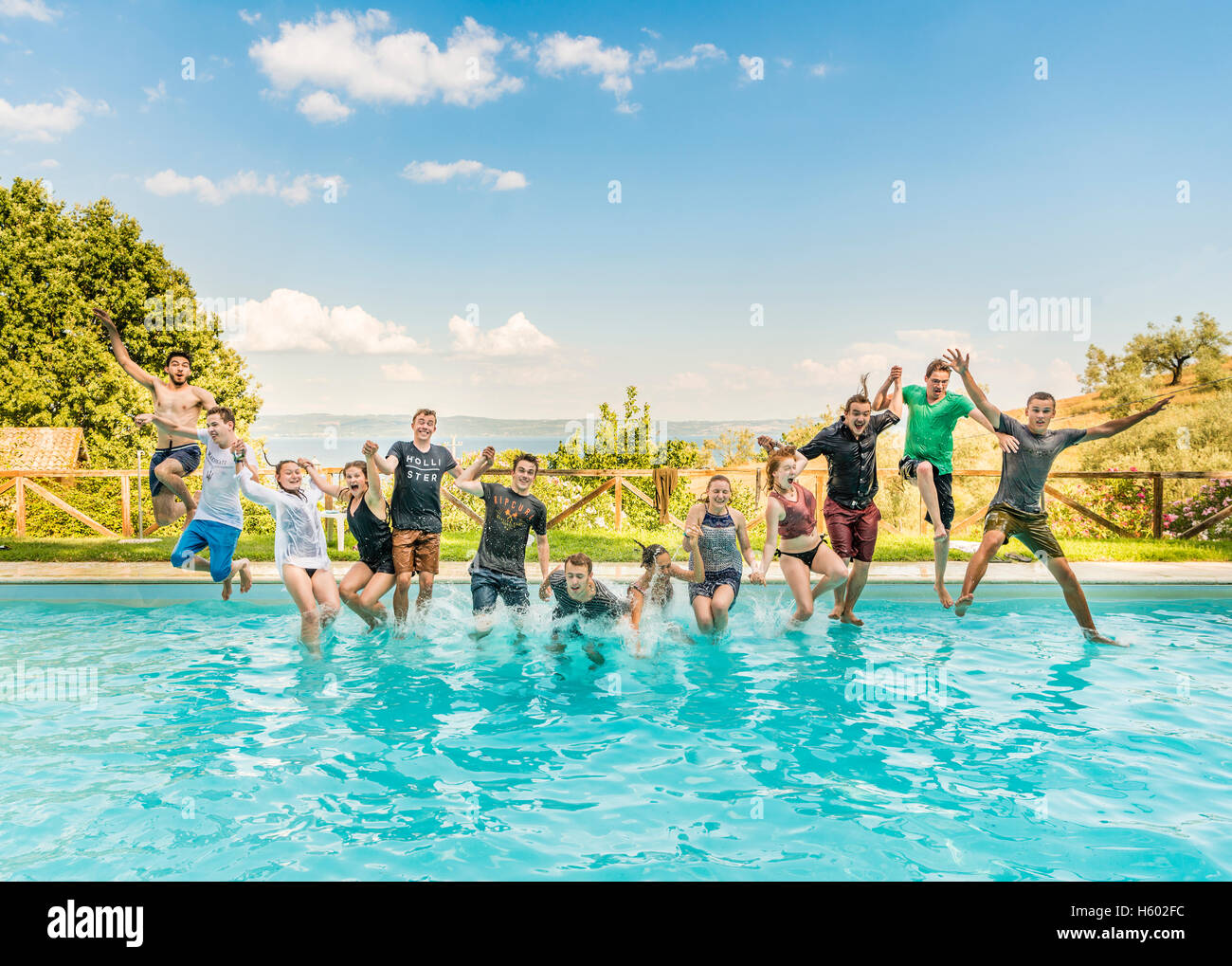 Group of teenagers, Teens jumping in pool, Lazio, Italy Stock Photo - Alamy