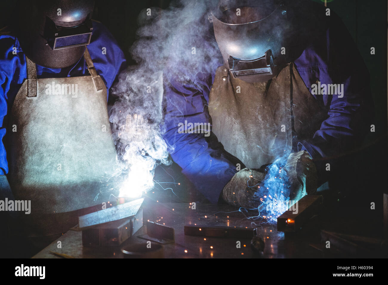 Welders welding a metal Stock Photo - Alamy