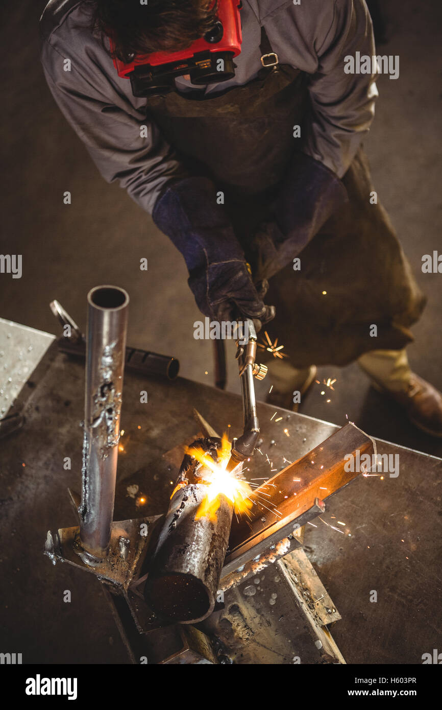 Welder welding a metal Stock Photo - Alamy