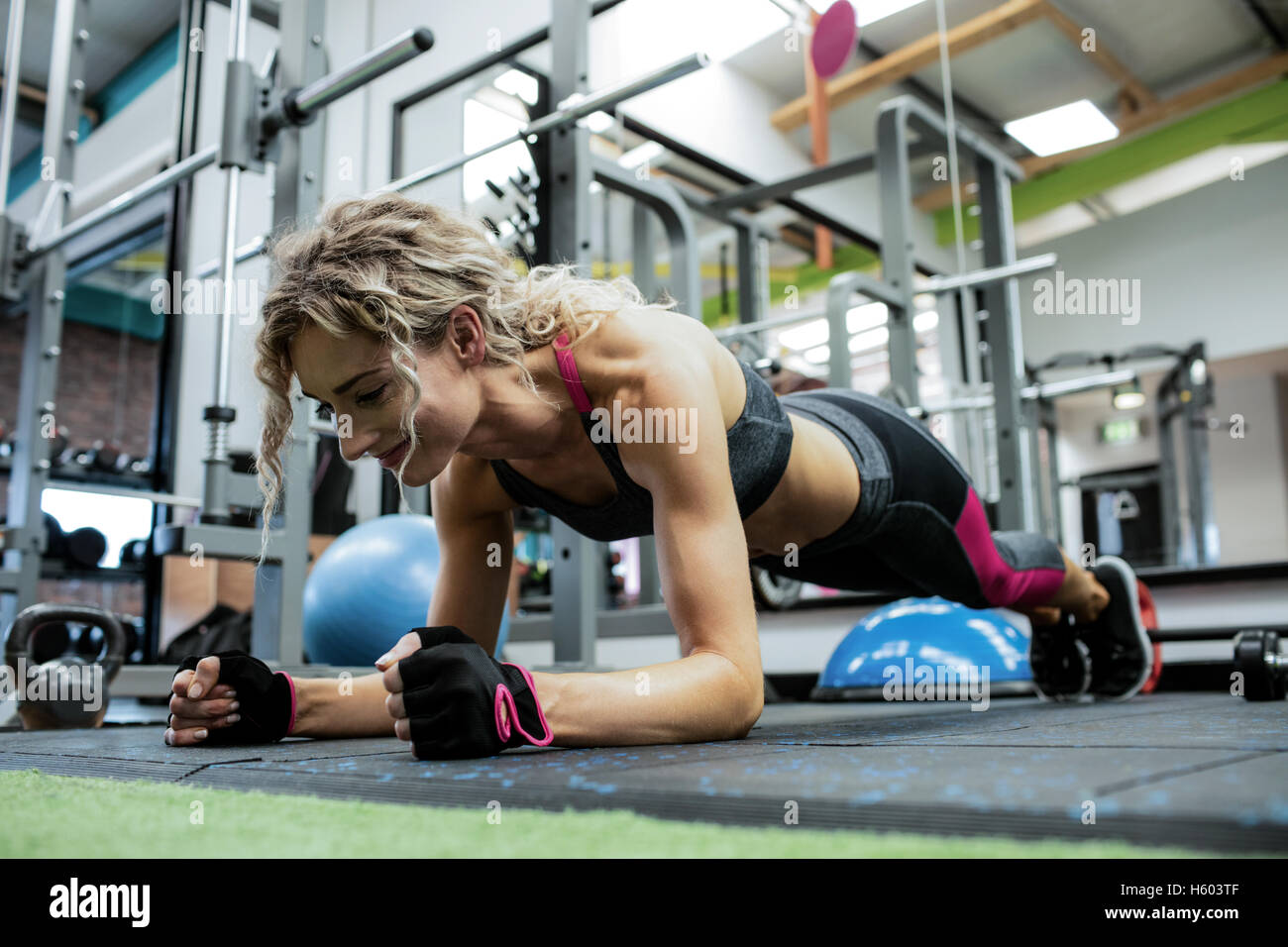 Woman performing push-up exercise Stock Photo - Alamy