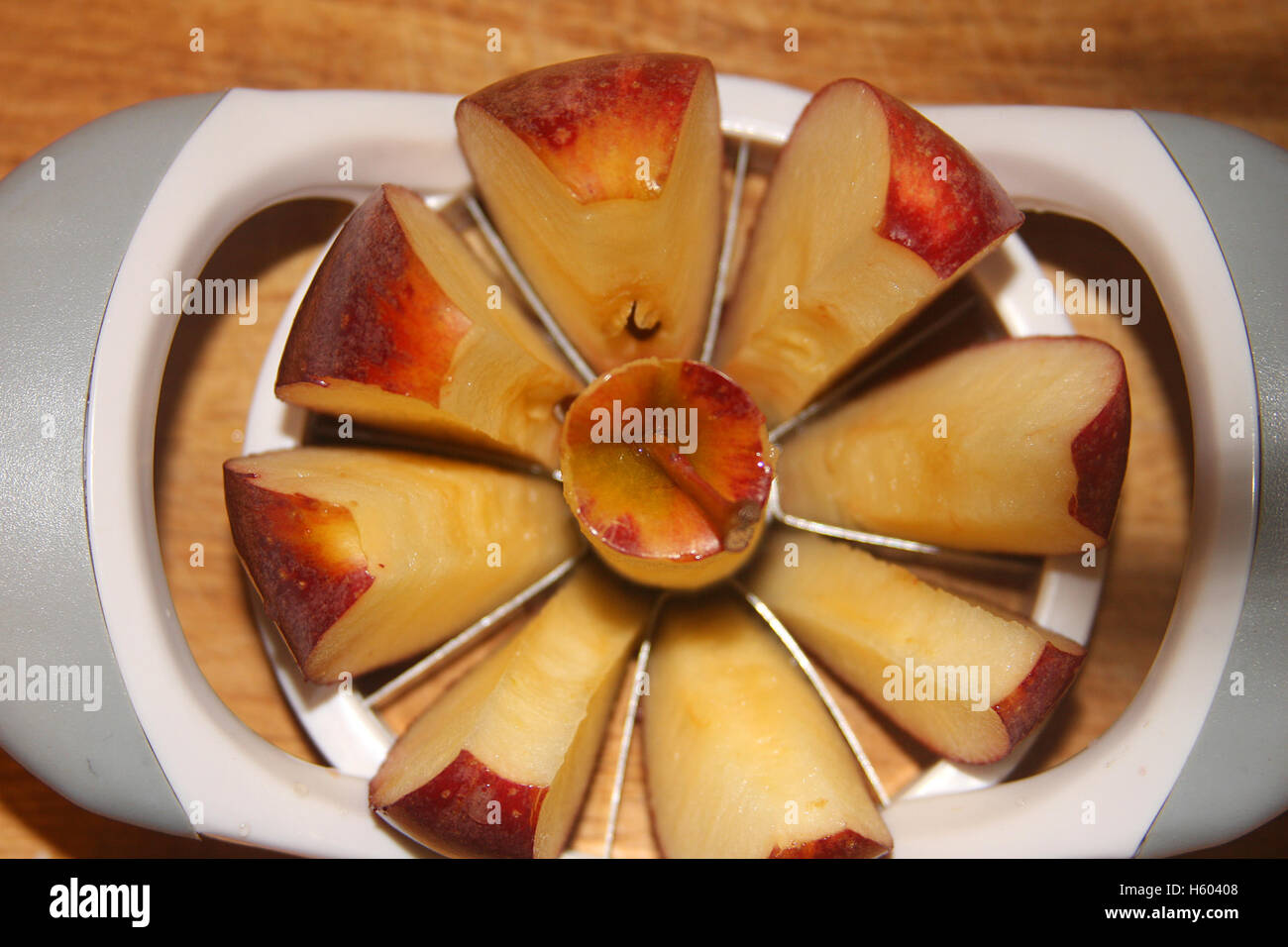 Apple cut with apple cutter Stock Photo - Alamy