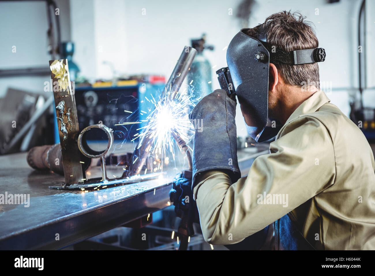 Welder welding a metal Stock Photo - Alamy