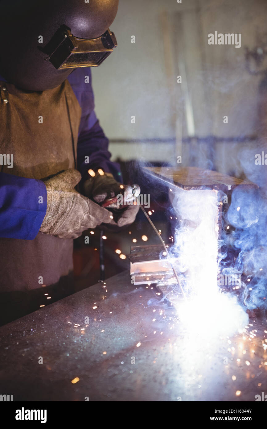 Welder welding a metal Stock Photo - Alamy