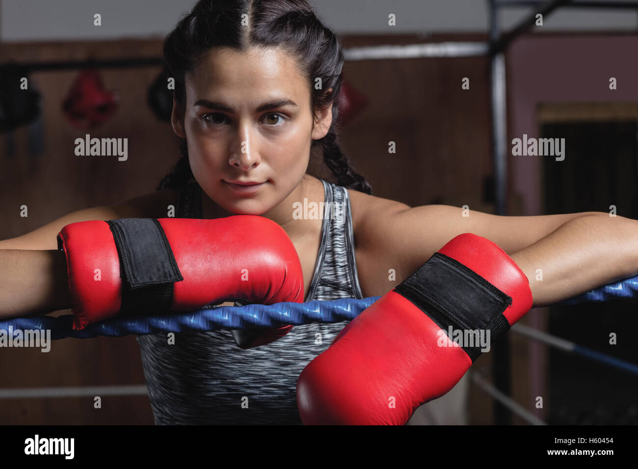 Tired female boxer in boxing gloves Stock Photo - Alamy