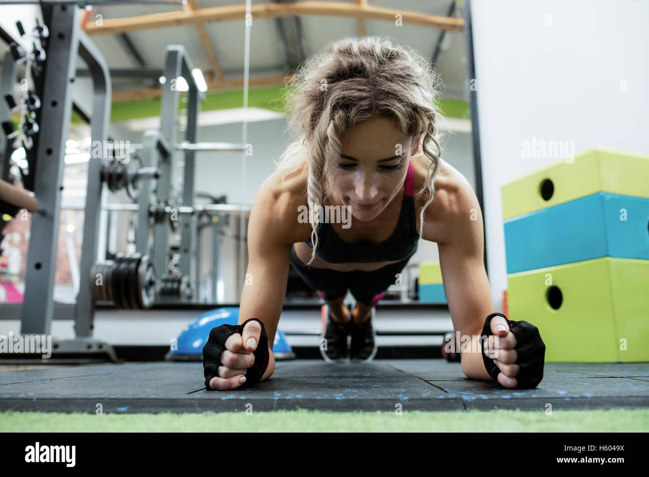 Woman performing push-up exercise Stock Photo - Alamy