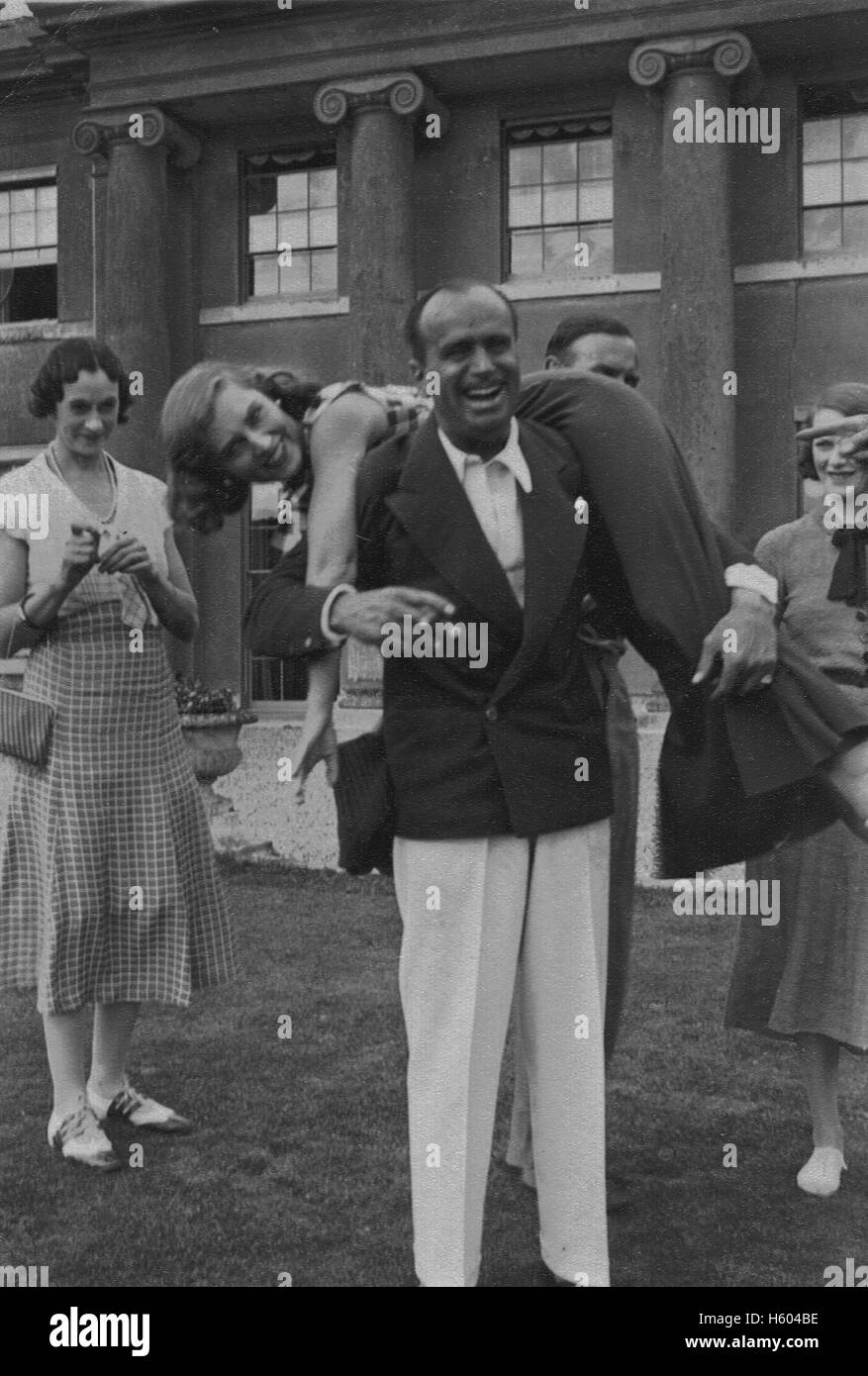American actor and director Douglas Fairbanks carries Lady Plunket over ...