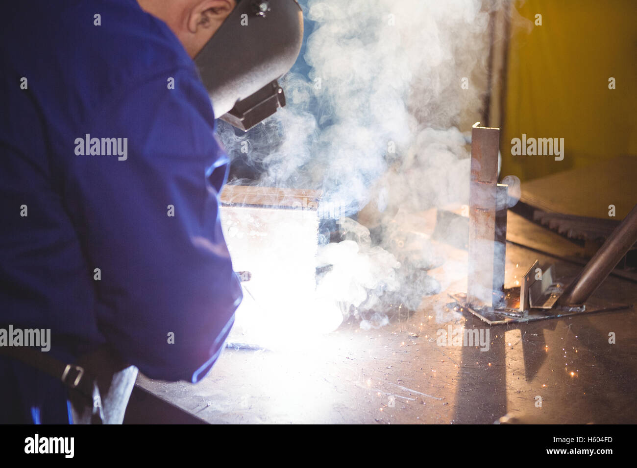 Welder welding a metal Stock Photo - Alamy