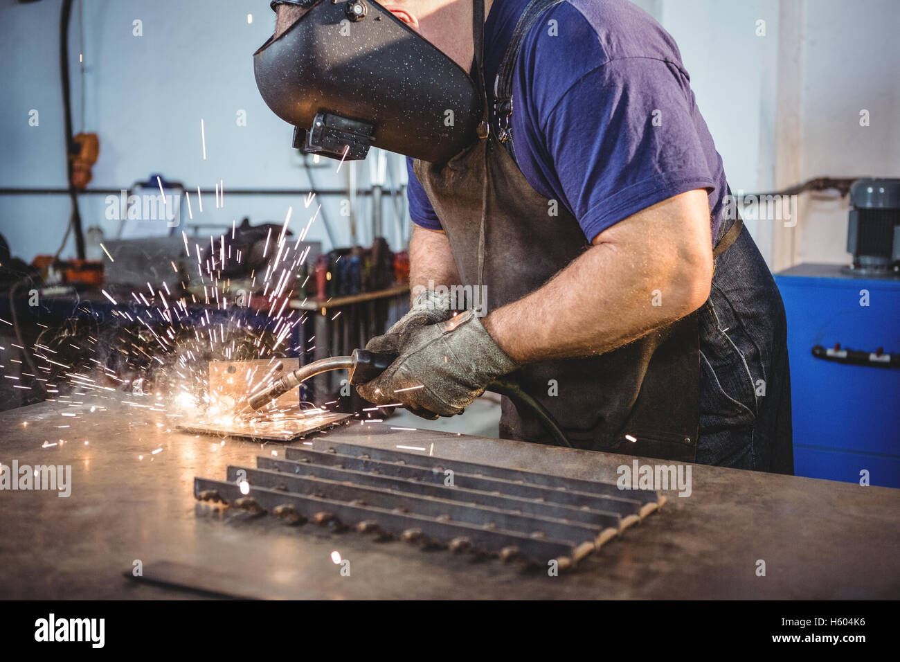 Welder welding a metal Stock Photo - Alamy