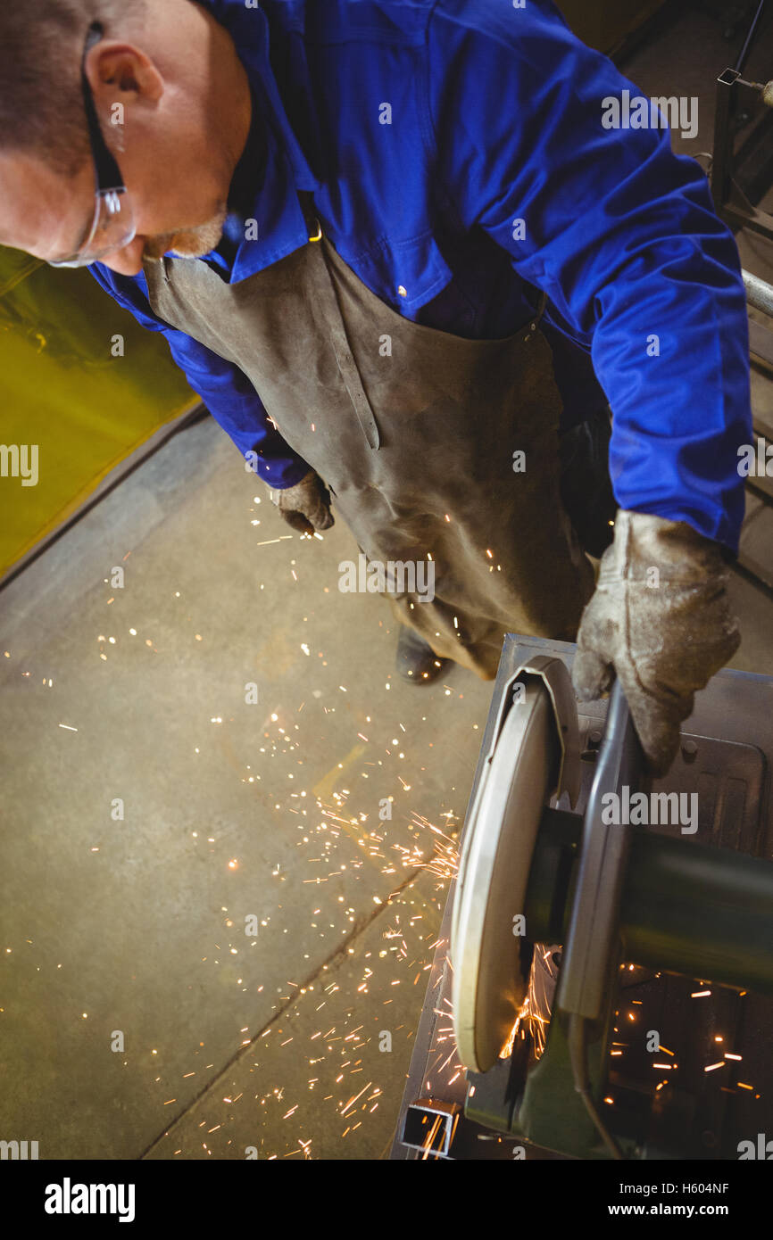Welder working at work shop Stock Photo - Alamy