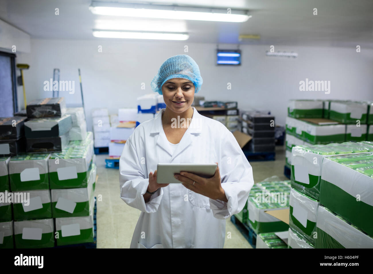 Female staff using digital tablet Stock Photo - Alamy