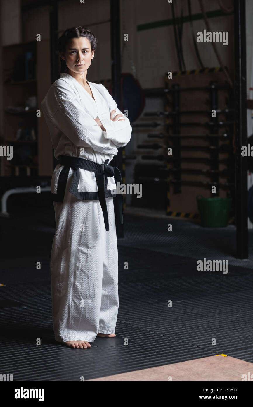 Portrait of woman standing with arm crossed Stock Photo - Alamy
