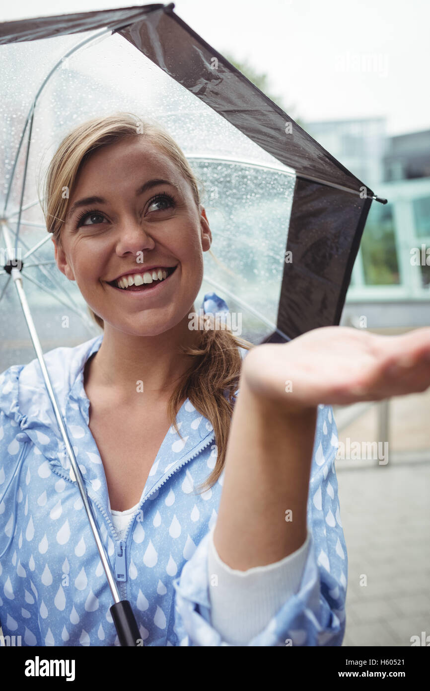 Beautiful woman enjoying rain Stock Photo - Alamy