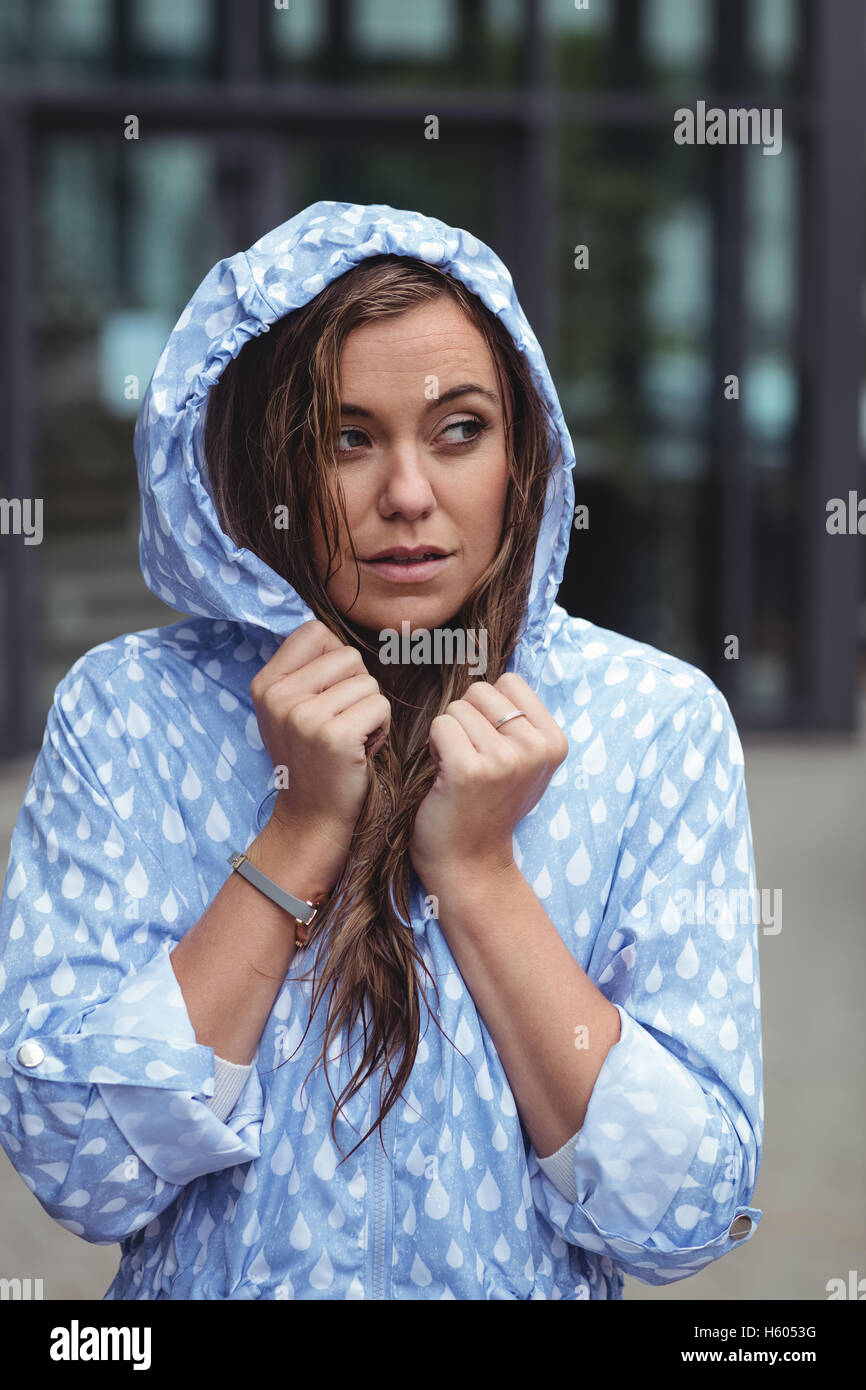 Thoughtful beautiful woman wearing windcheater Stock Photo - Alamy