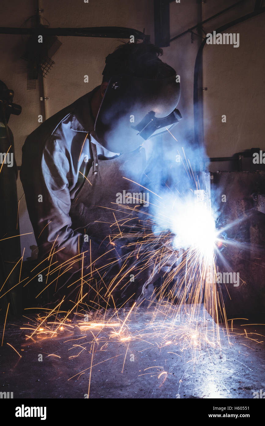 Welder welding a metal Stock Photo - Alamy