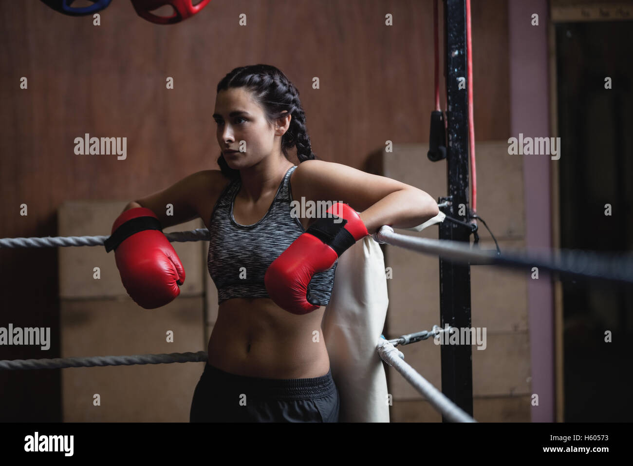 Tired female boxer in boxing gloves Stock Photo - Alamy