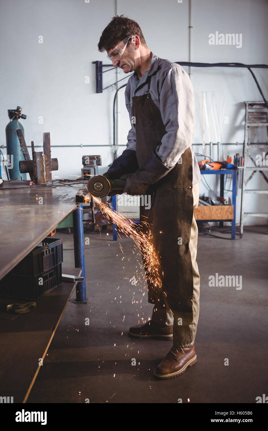 Welder working at work shop Stock Photo - Alamy
